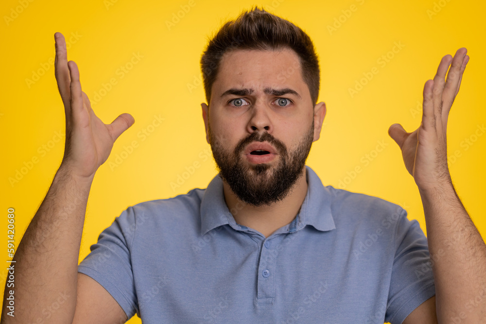 Excited amazed caucasian man touching head and showing explosion ...