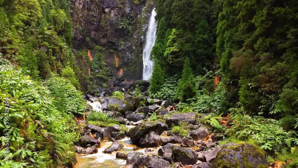 Waterfall in Sao Miguel, Azores. Track of water fall amidst beautiful ...