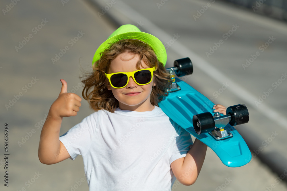 Child boy holding longboard on street. Kid with pennyboard outdoor ...