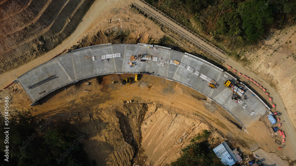 Aerial view of development of new road construction or overpass under ...