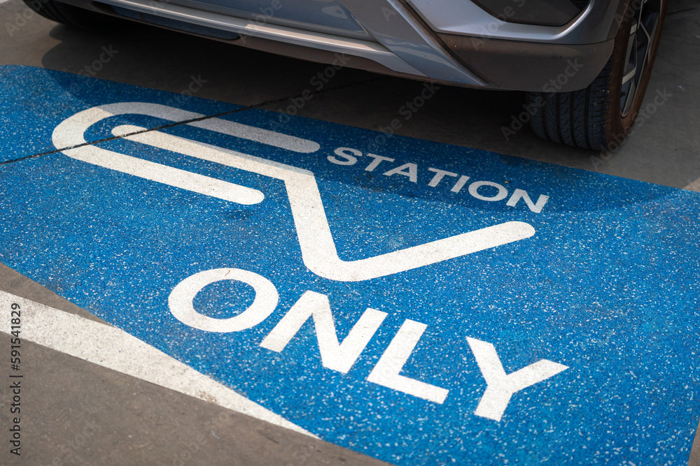 Sign on parking lot that reservation for EV car only at electric ...