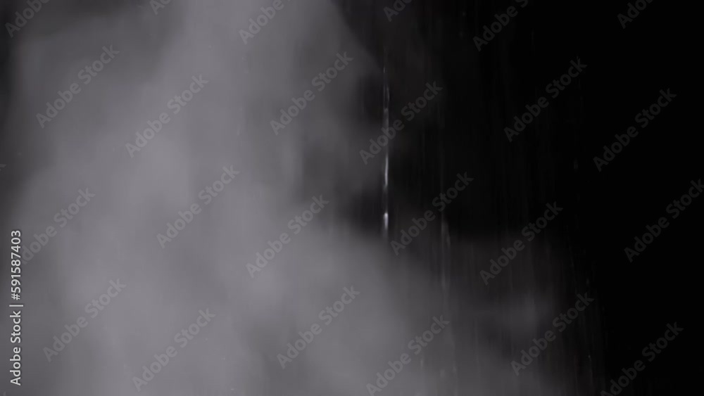 Falling Stream of Splashes on a Rising Cloud of Water Vapor on Black ...