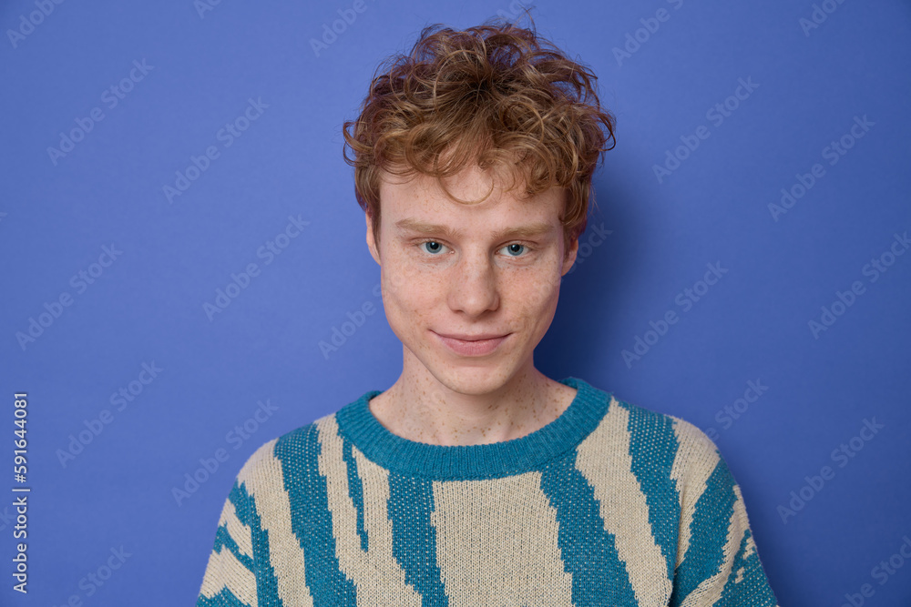 Portrait gen z smile headshot. Male teenager with red curly hair ...
