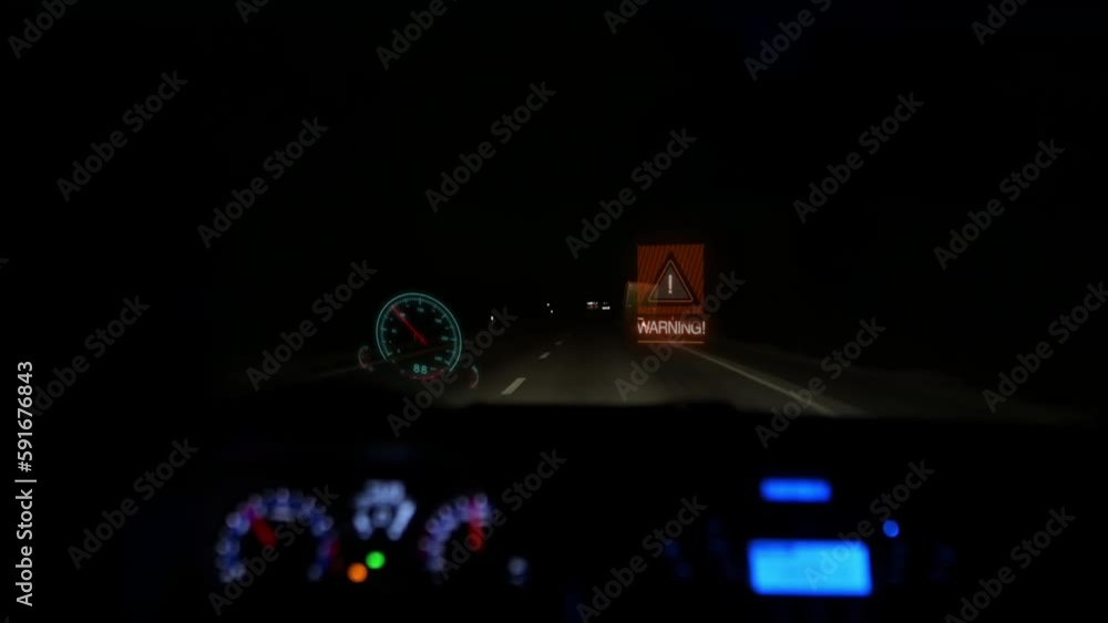 A futuristic concept: An autonomous car driving on a nighttime highway ...