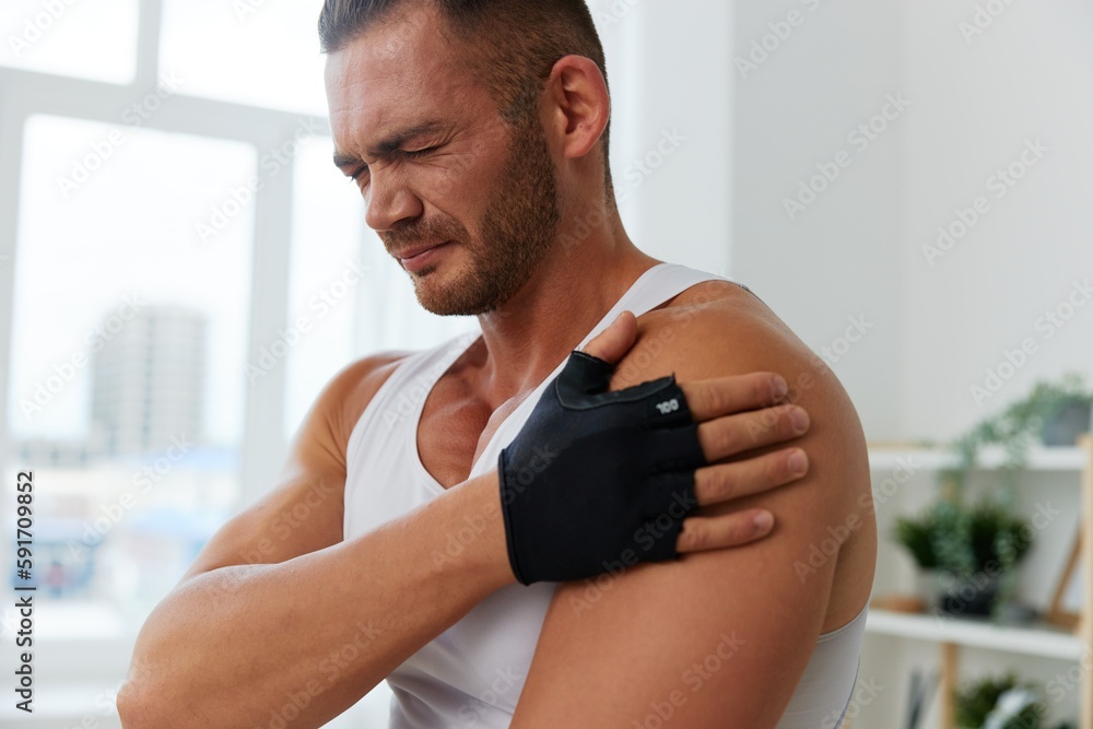 Man sports arm pain muscle and ligament sprain from working out at home ...