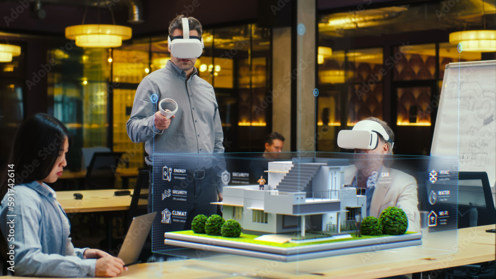 Male designer uses VR headset and wireless controllers, presents smart ...