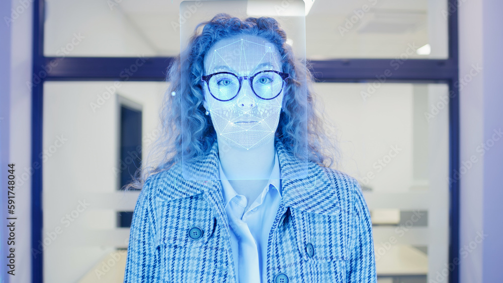 Adult woman scans face in coworking office. Security system software ...