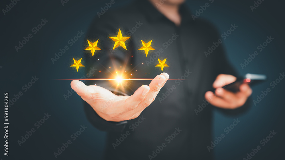 Customer or client man hand showing the stars icon to complete five ...