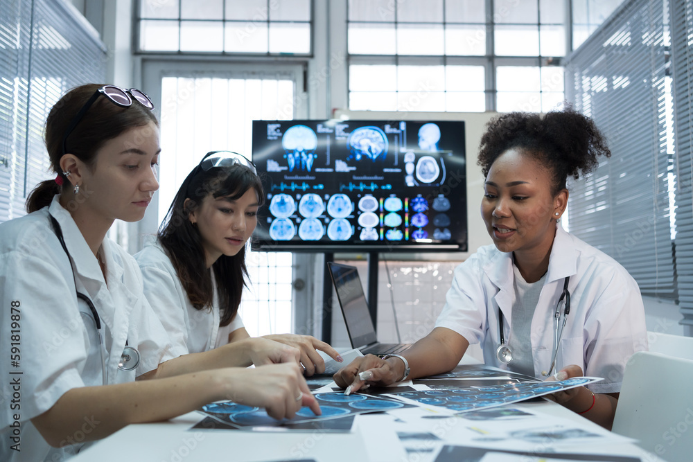 Group of female medical scientists meeting in brain research lab by ...