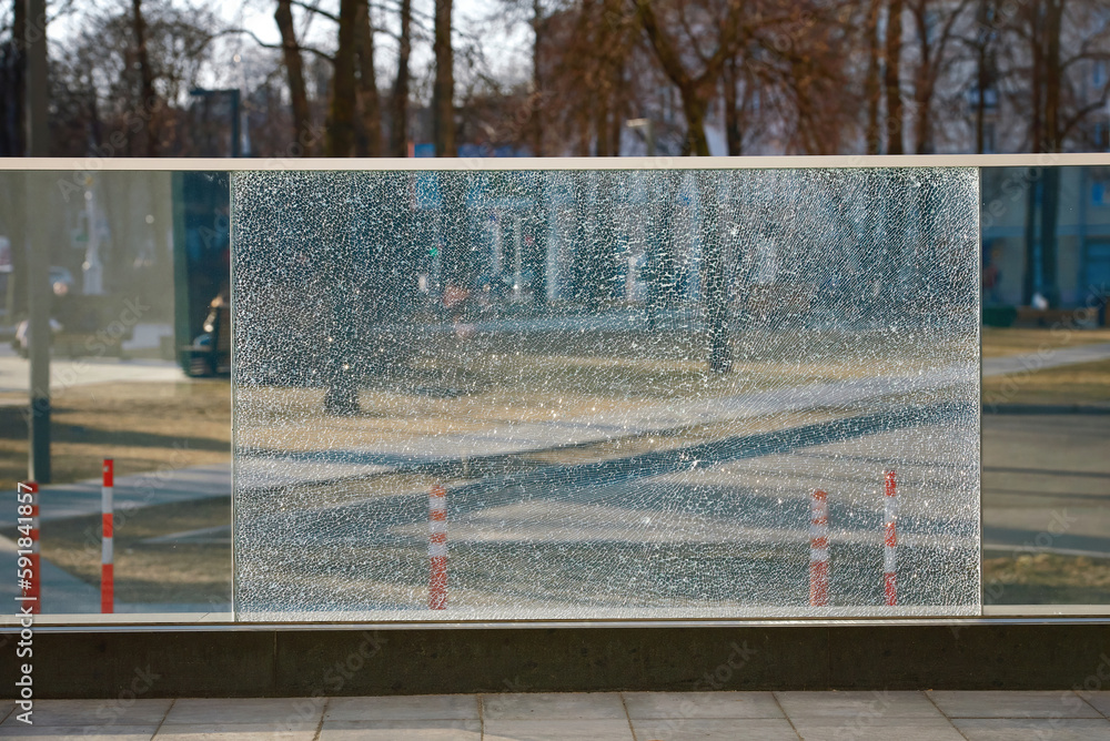 Damaged tempered glass fence. Broken glass fence with banisters. Broken ...