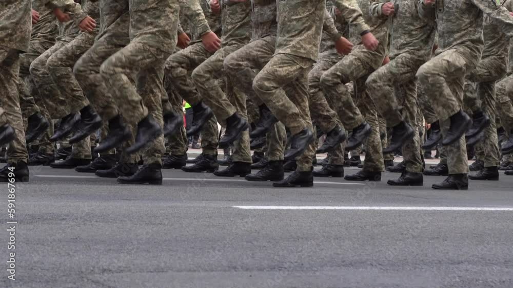 Many legs go in a row. Military uniform. A company of soldiers marching ...