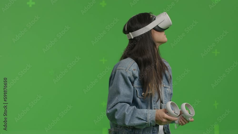 GREEN SCREEN CHROMA KEY Portrait of Asian female using VR headset Stock ...