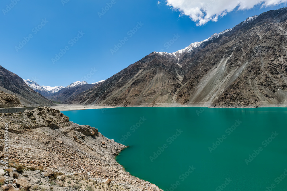 Serene beauty of Satpara or Sadpara Lake with its turquoise waters, a ...