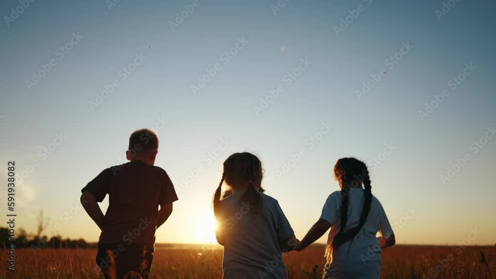 Children running in park at sunset. happy family kindergarten kids ...