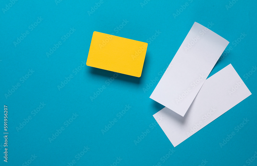 Mockup of yellow blank bank card with chip and white check tapes on ...