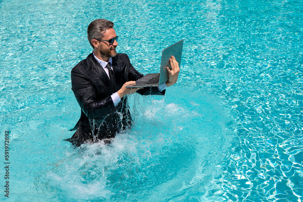 Crazy business man relaxing in suit on swimming pool. Summer vacation ...