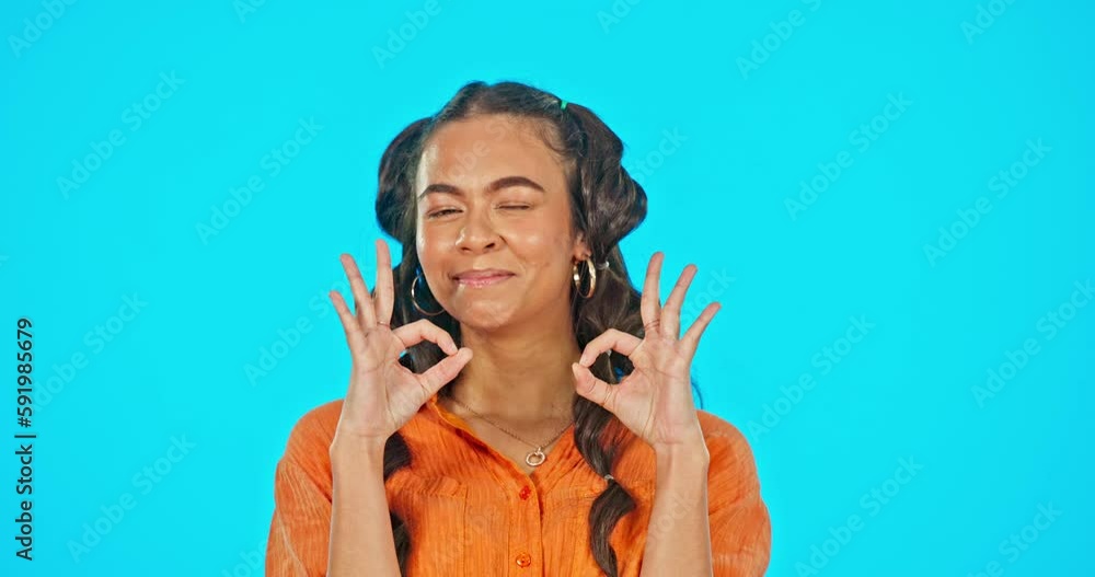 Smile, face and okay hand gesture, woman on studio backdrop with mockup ...