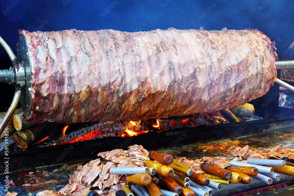 flat doner kebab meat being cut before making a sandwich erzurum cağ ...