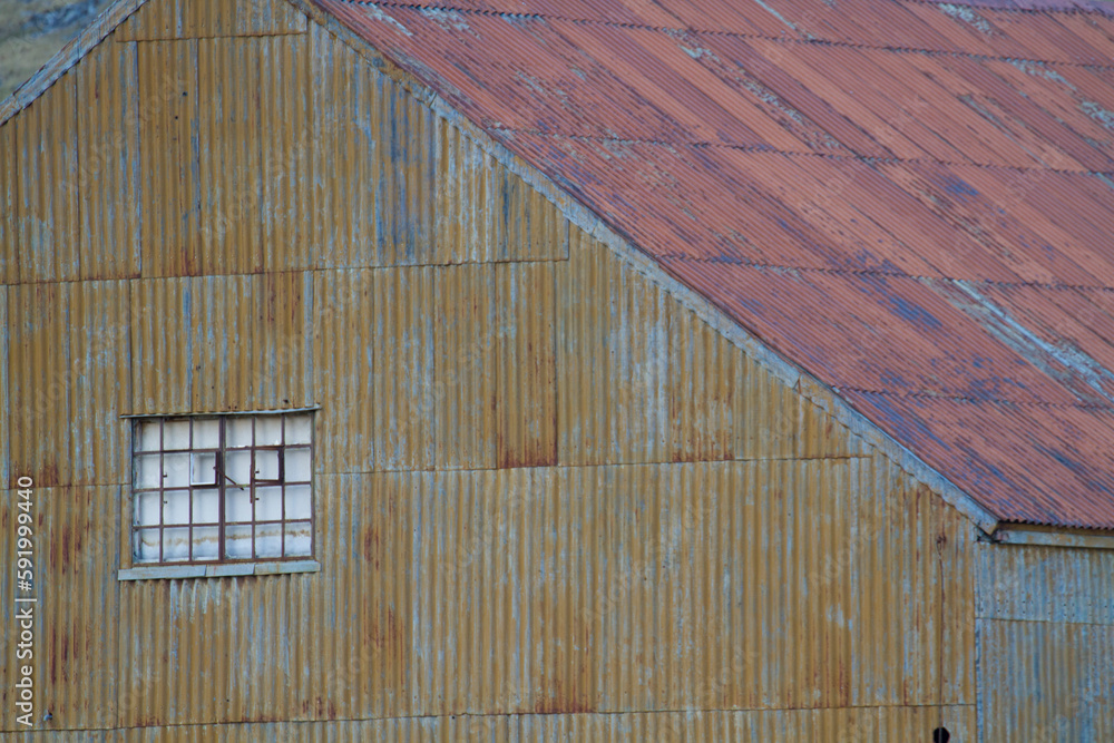 Rusty corrugated metal building at the abandoned Stromness whaling ...