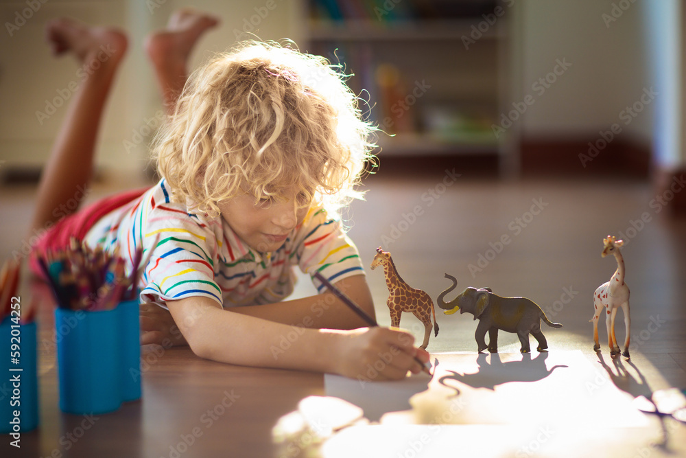 Little boy shadow drawing animals. Stock Photo | Adobe Stock