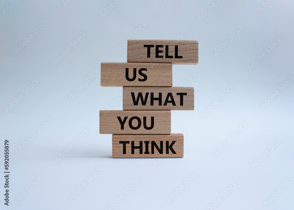 Tell us what you think symbol. Wooden blocks with words Tell us what ...