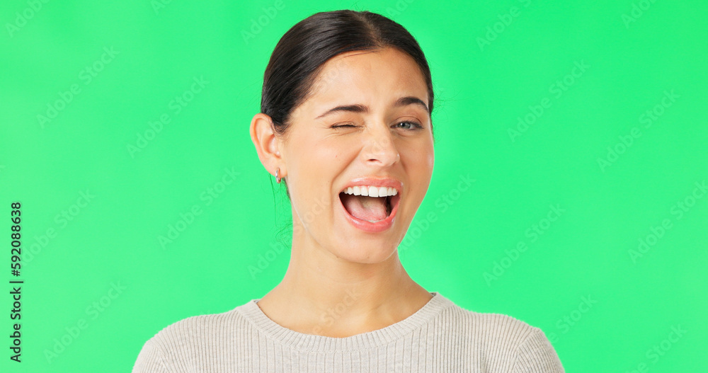Happy, woman and winking face on green screen, studio and color ...