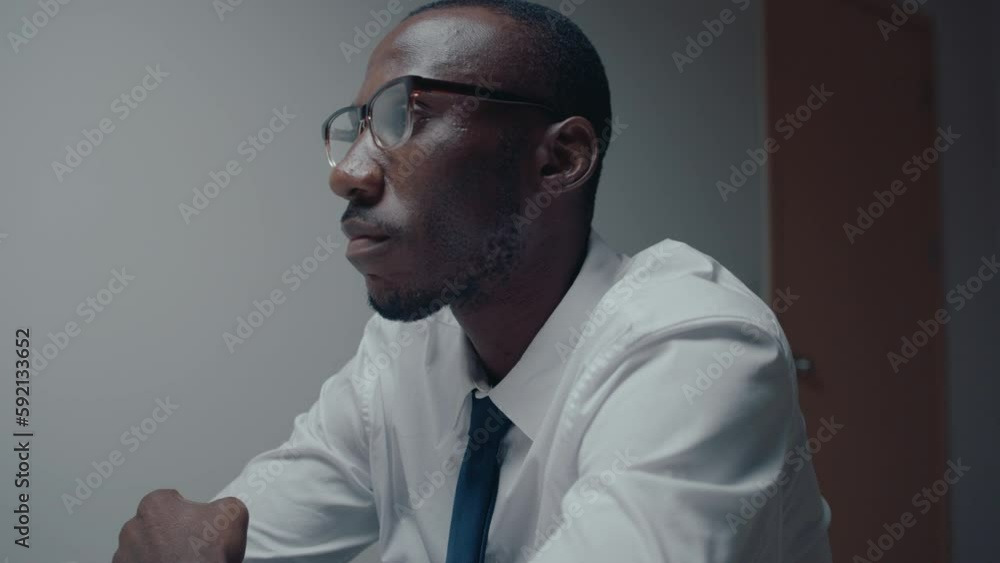 African American male police officer wearing formal shirt and tie ...