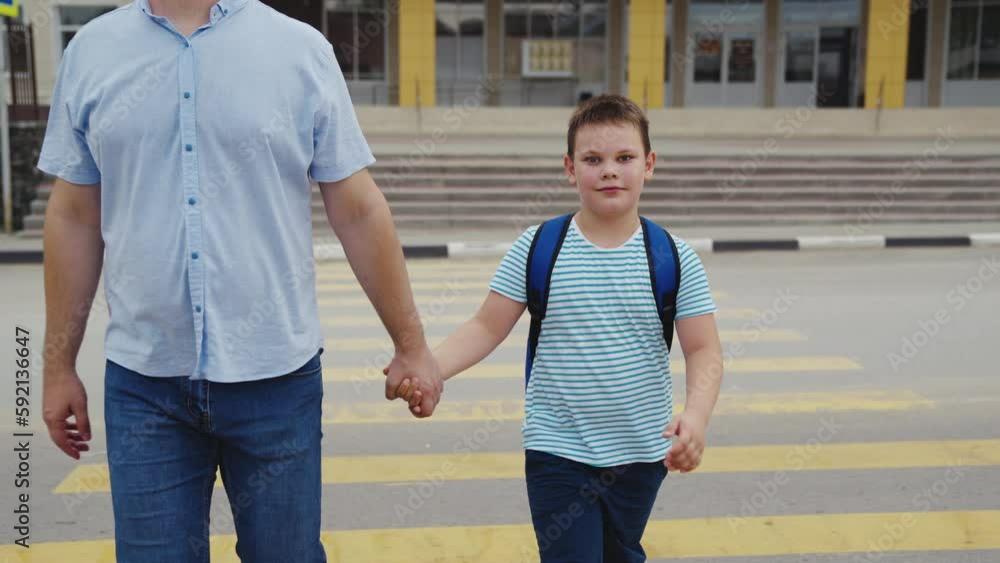 father holding hand his son child crossing road pedestrian crossing ...