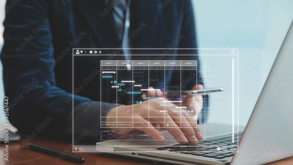 Project manager working with Gantt chart schedule to plan tasks and ...
