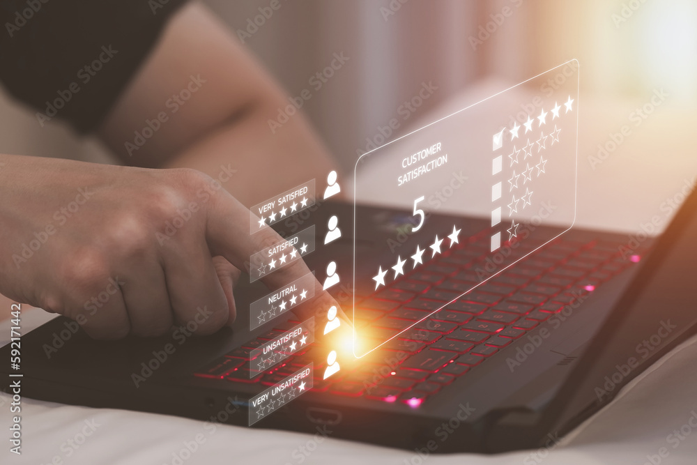 Business man rating satisfaction as a customer via typing on laptop ...