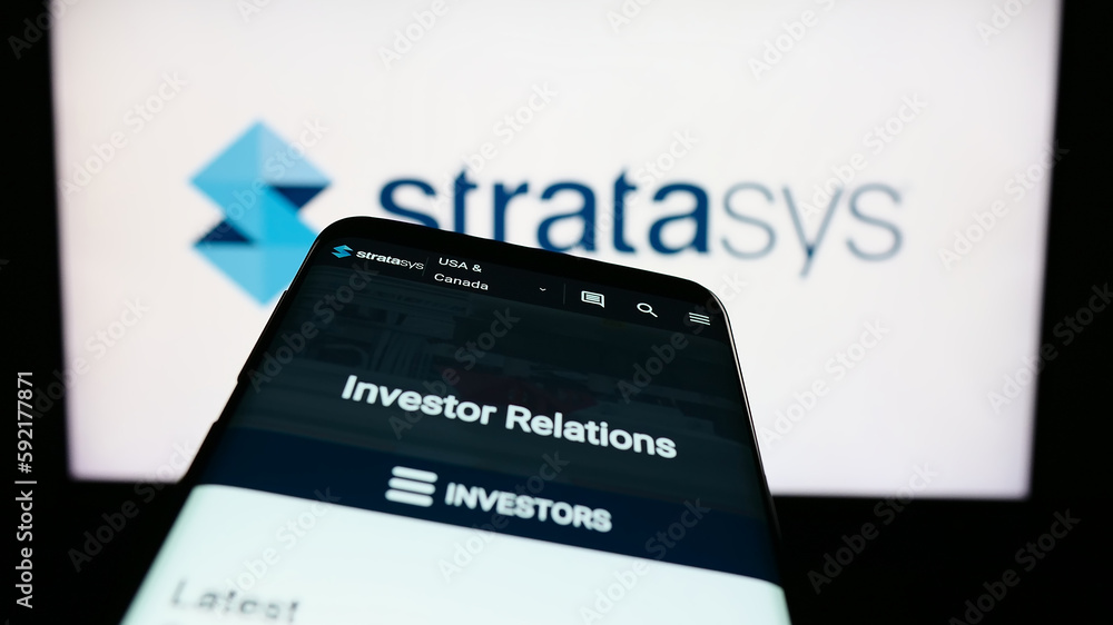 Stuttgart, Germany - 04-01-2023: Smartphone with webpage of 3D printing company Stratasys Ltd ...