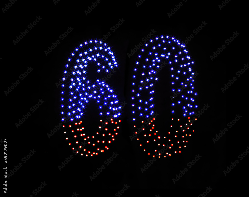 Drone light shows on black night sky background. A figure of the number ...