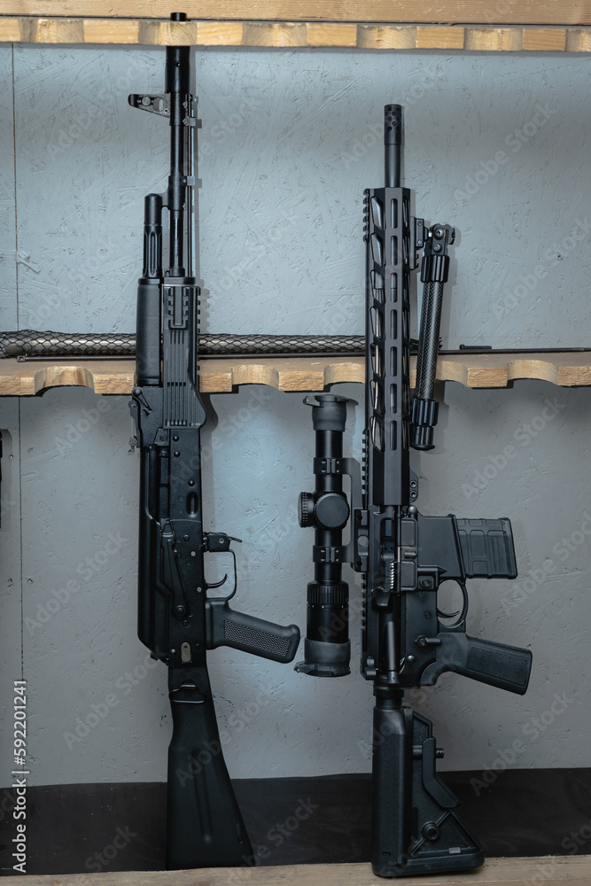 Two rifles in the armory. Ar 15 with optical sight and ak74m. Stock ...