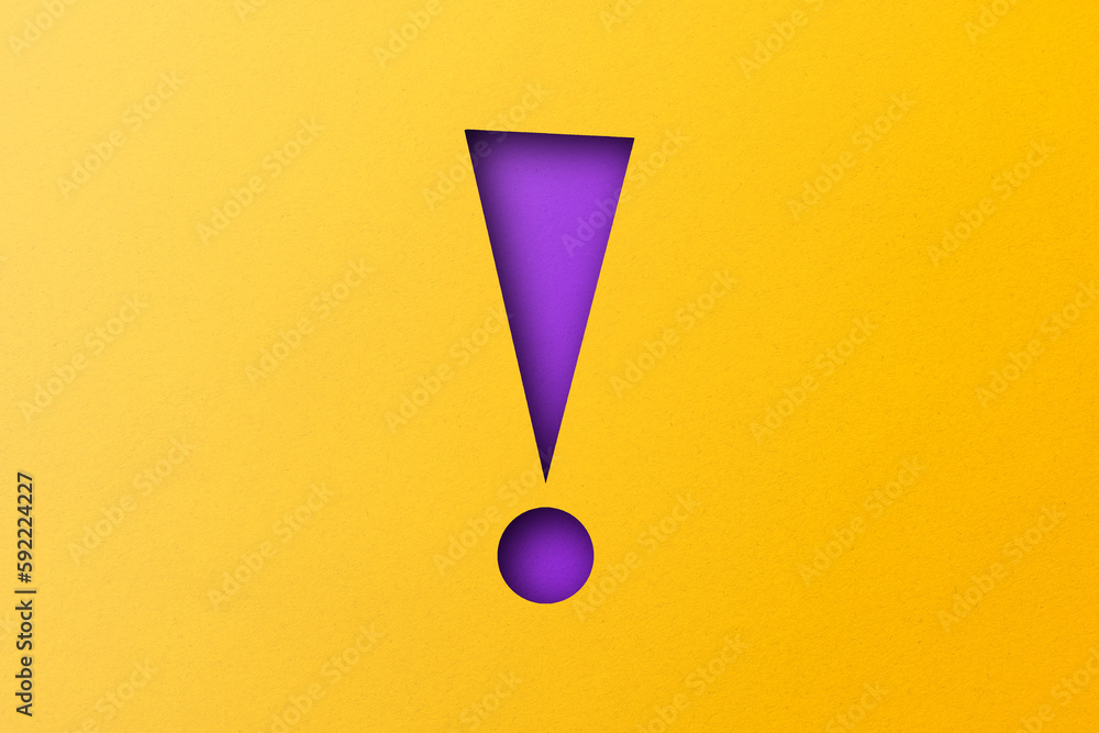 Purple paper punched into the shape of an exclamation mark. warning ...