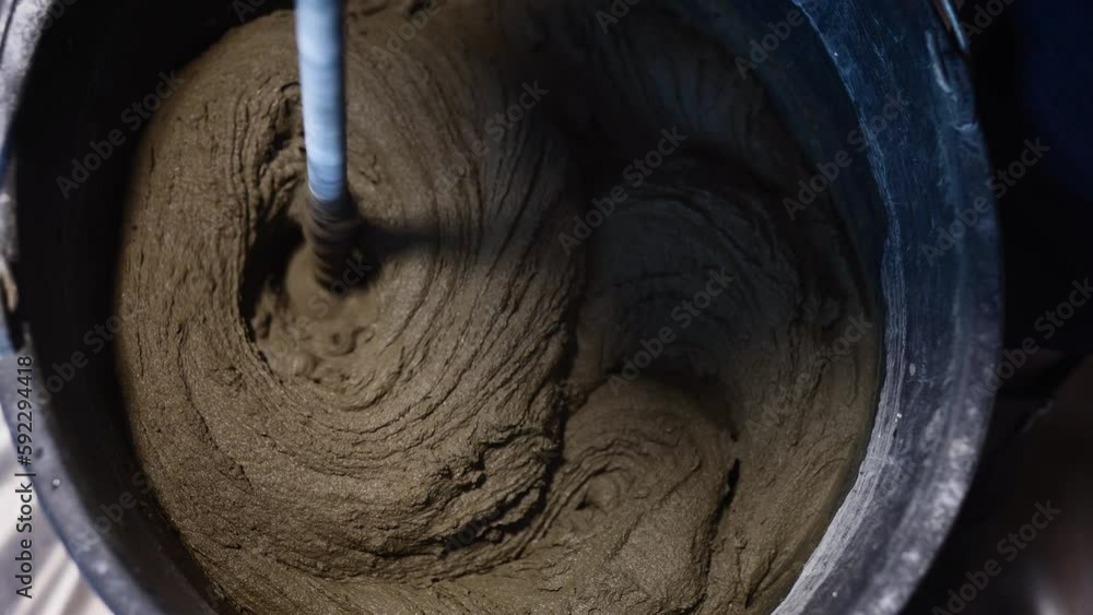 The process of preparing tile adhesive or cement mortar. Mechanical ...