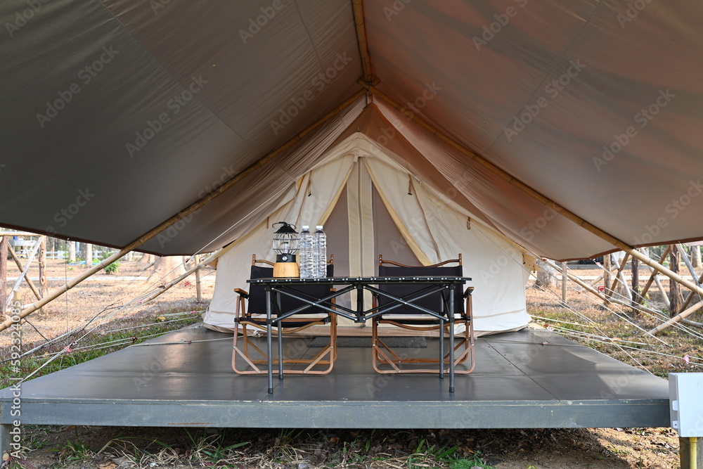Large camping tent for luxurious outdoor getaway. White traditional ...