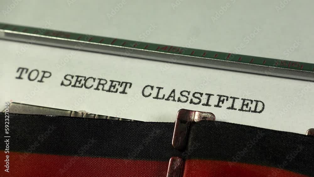Typing a Top Secret Classified document on an old manual typewriter. Classified and top secret ...