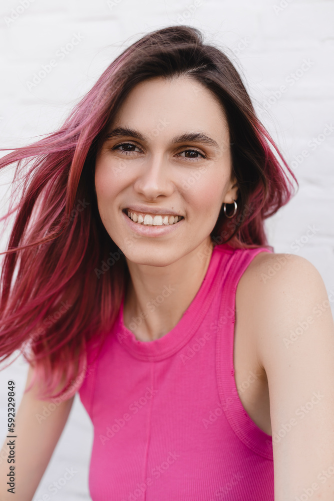 Positive pink hair woman in pink top. Portrait of happy attractive lady ...