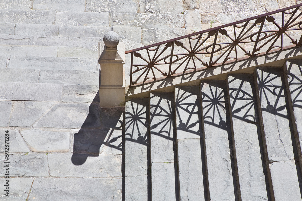 Architectural barriers concept with old stone staircase with wrought ...