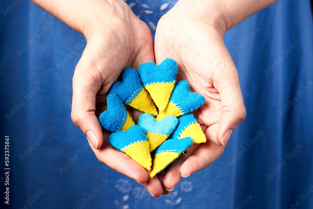 Ukraine flag theme. Many heart shape pin badge made of blue and yellow ...