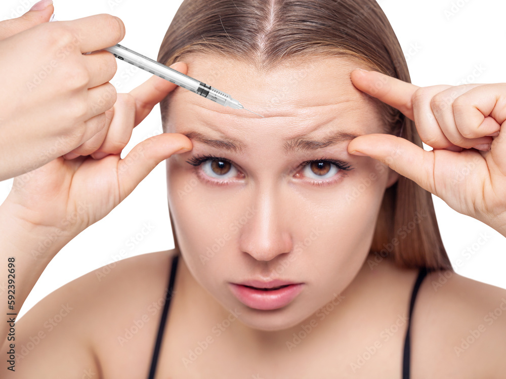 Beautiful woman has an injections in forehead. Stock Photo | Adobe Stock