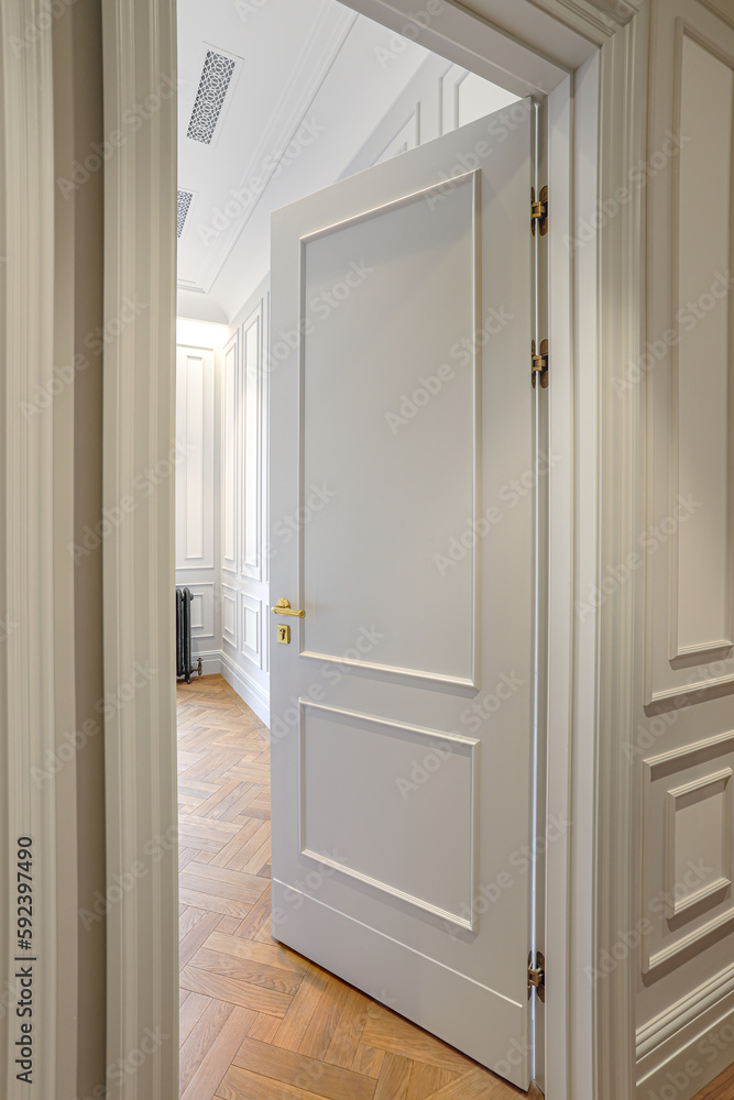 vertical corner frame on part of interior with white wall ajar door and ...