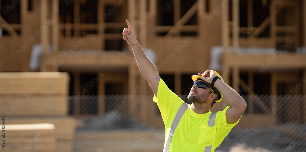 Construction builder in building uniform on buildings construction ...