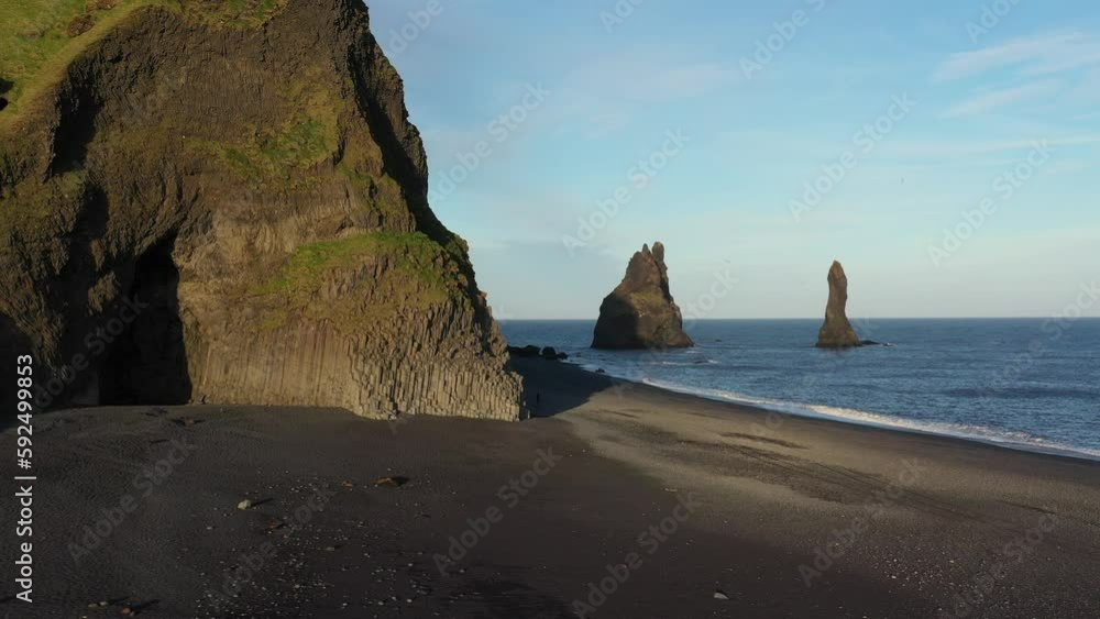 Reynisfjara black sand beach with basalt columns and sea cliffs on the ...