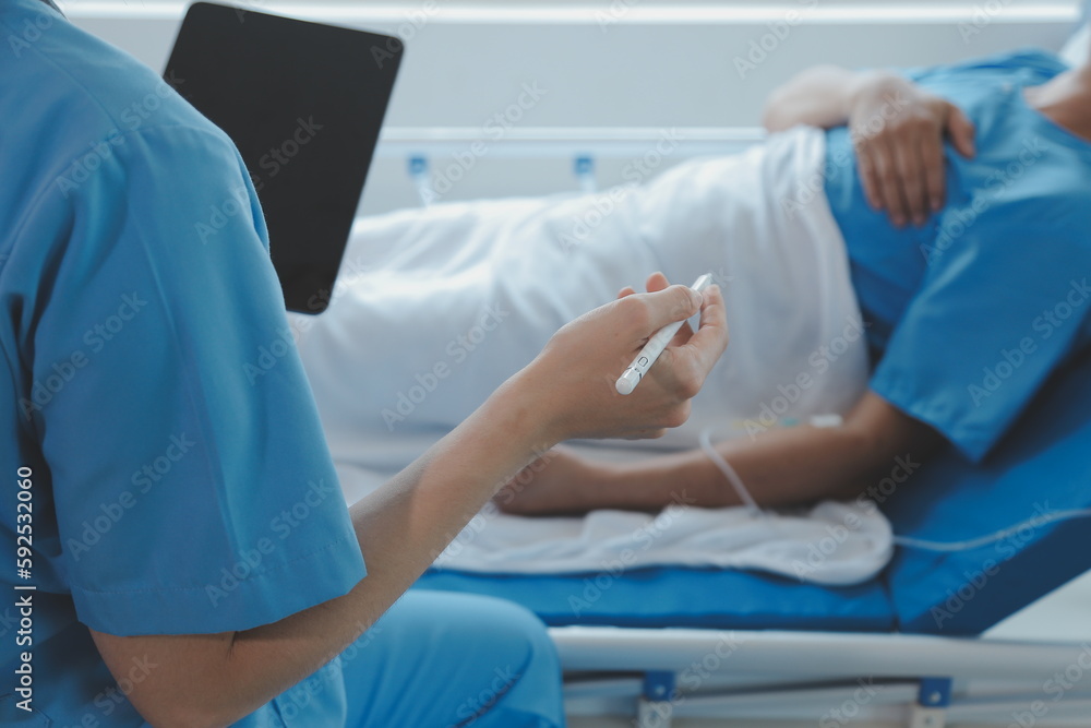 Injured patient showing doctor broken wrist and arm with bandage in ...