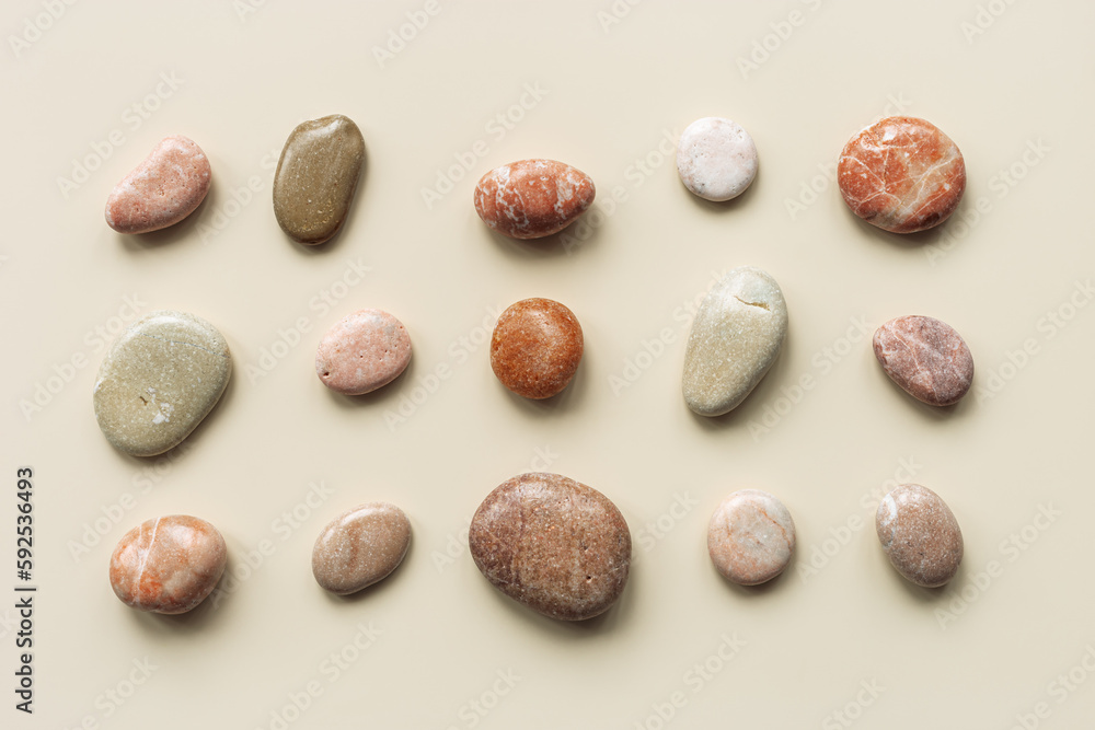 Aesthetic minimal pattern with set of sea pebble stones on beige ...