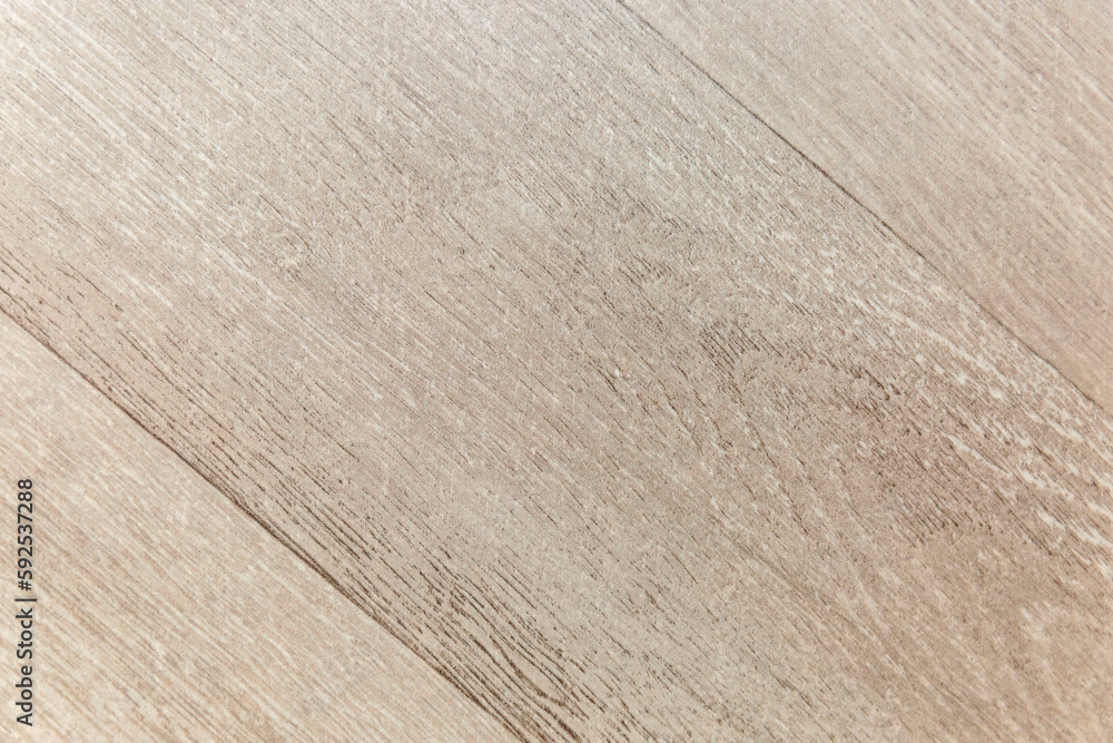 The surface of the beige wood flooring. Laminate and parquet board ...