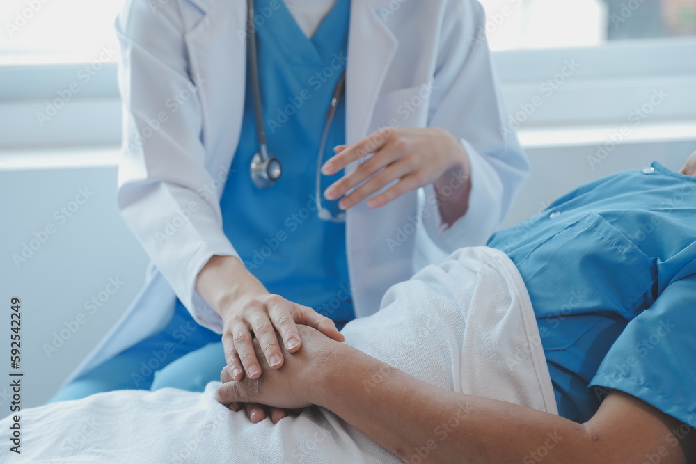 Injured patient showing doctor broken wrist and arm with bandage in ...