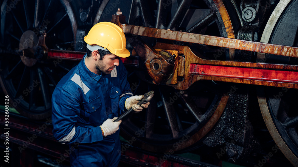 Engineer railway wearing safety uniform and helmet under checking under ...