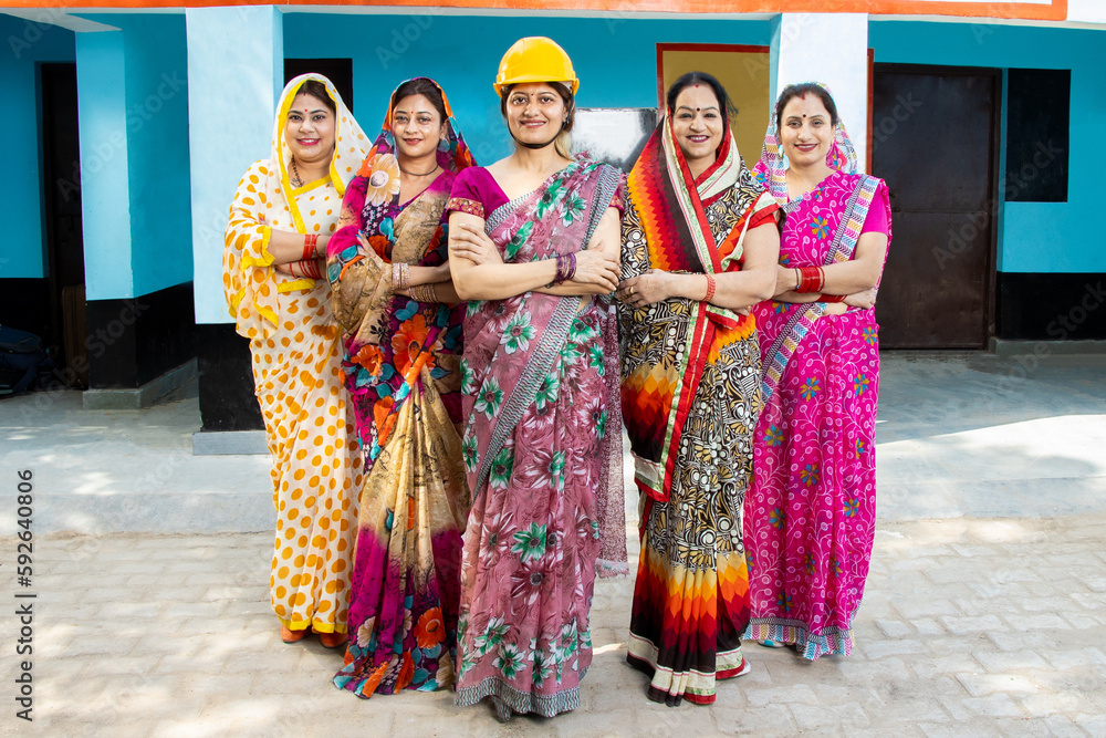 Group of confident young indian women wear sari standing with female ...